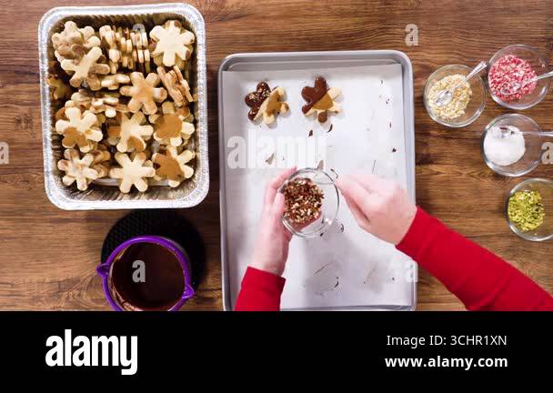 Flat lay. Preparing star-shaped cookies, half-dipped in chocolate ...