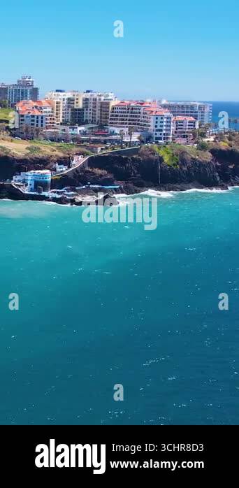 Aerial view of turquoise waters of Praia Formosa beach and colorful ...