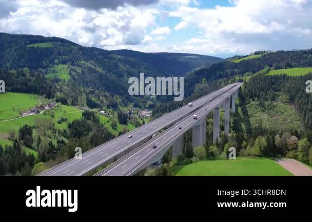 4k Aerial view of the autobahn, moving cars. Countryside summer road in ...