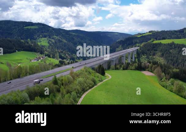 4k Aerial view of the autobahn, moving cars. Countryside summer road in ...