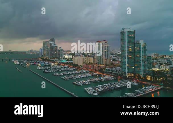 Miami Beach at night with dramatic sky. Miami seaside at dusk. Aerial ...