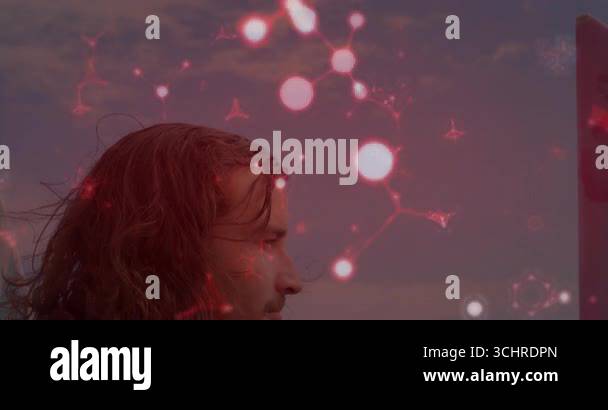 Wind blowing hair and initiating red particles as couple embracing at ...