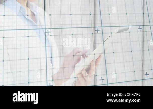 Hands tapping tablet screen causing UI grid overlay surrounding medical ...