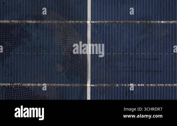 Drone-mounted camera hovering above solar panel with busbar moving ...
