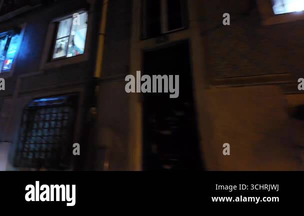 Lisbon Portugal at night POV taxi ride illuminated city streets ...