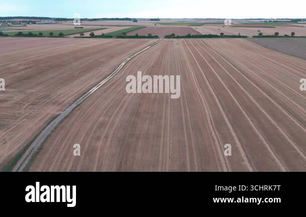 Majestic aerial journey over expansive rural farmland and vibrant ...