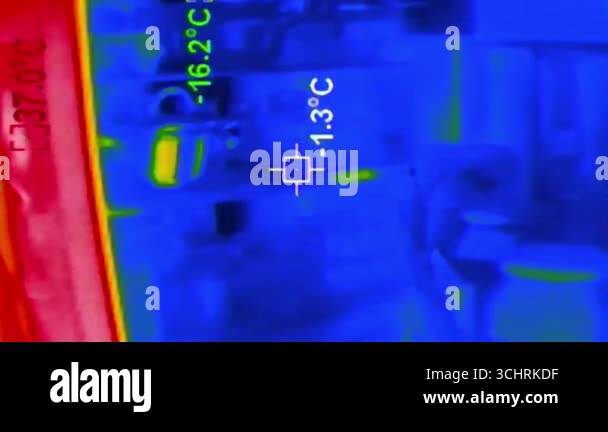 Thermal camera shows a hand opening a fridge, revealing the temperature ...
