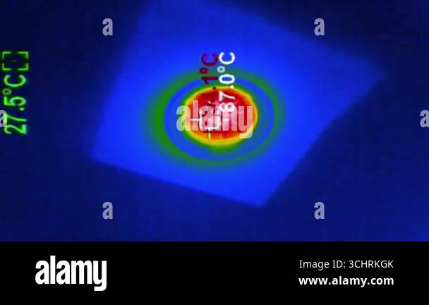 Top-down thermal camera view of an LED lamp on the ceiling actively ...