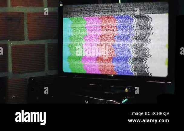 Computer Monitor with Green Screen Against Brick Wall in A Shanty House ...