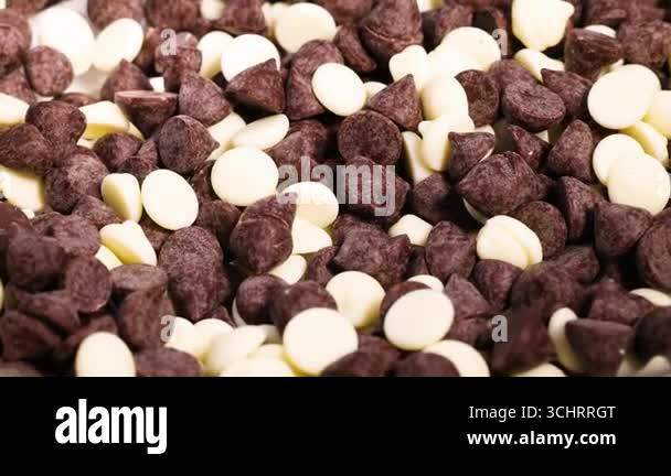 Dark and white chocolate chips being mixed together Stock Video Footage ...