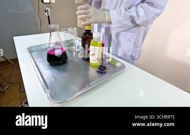Scientist conducts a vibrant chemical experiment using beakers and ...