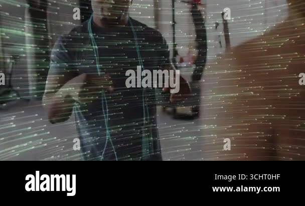 Gym trainer adjusting green jump rope draping and gesturing client for ...