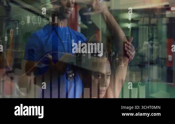 Fitness trainer placing hands on client's wrists guiding overhead ...