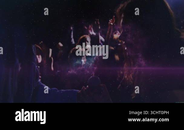 Host extending mic, singer grabbing mic singing music as crowd dancing ...