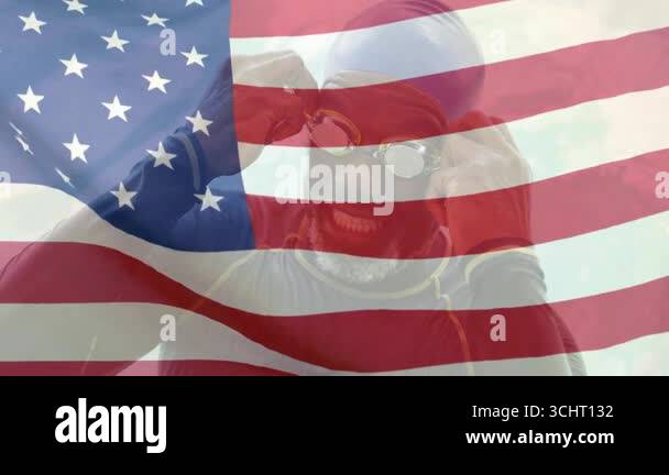 transparent flag overlay revealing male athlete adjusting goggles and ...