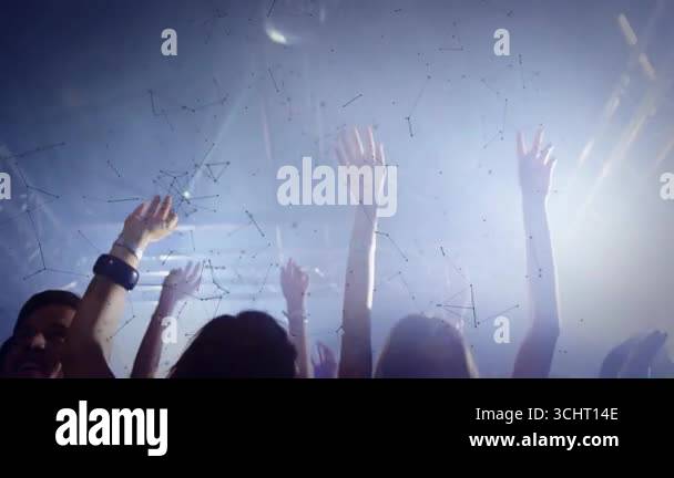 Fog machine haze rising as concert crowd raising hands, shifting ...