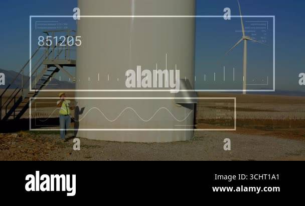 Field technician calling handset and monitoring tablet while inspecting ...