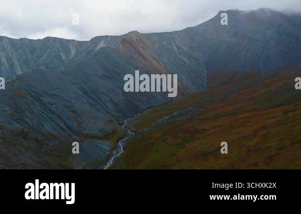 Stunning mountain valley landscape showcasing vibrant autumn colors and ...