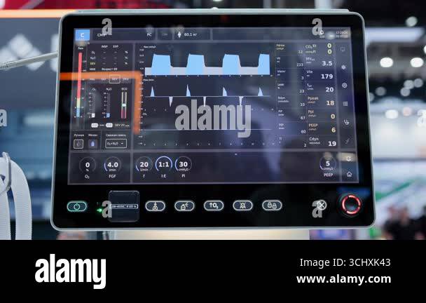 Electronic display of a medical ventilator showing vital signs and ...