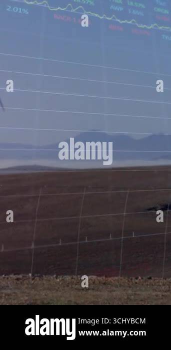 Animation of financial data and graph over landscape with wind turbines. Ecology, green energy ...