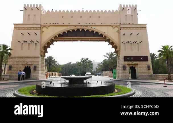 People walking near gate and fountain Stock Video Footage - Alamy