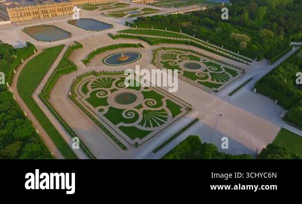 Aerial view of Palace of Versailles and the gardens surrounding it ...