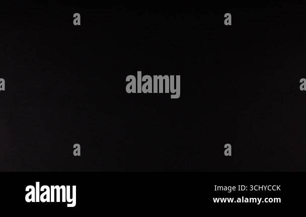 Soccer balls moving across a dark surface Stock Video Footage - Alamy
