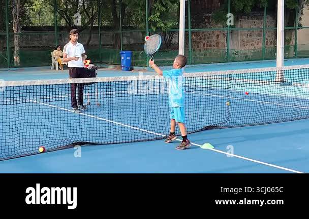 Delhi, India, February 17, 2025 - Junior tennis players having coaching ...