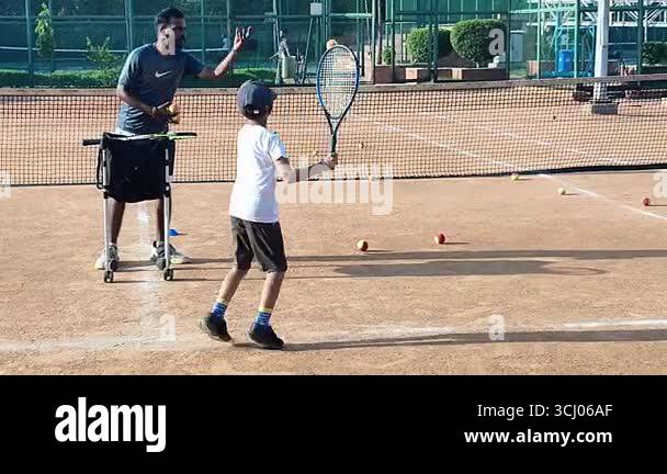 Delhi, India, February 17, 2025 - Junior tennis players having coaching ...