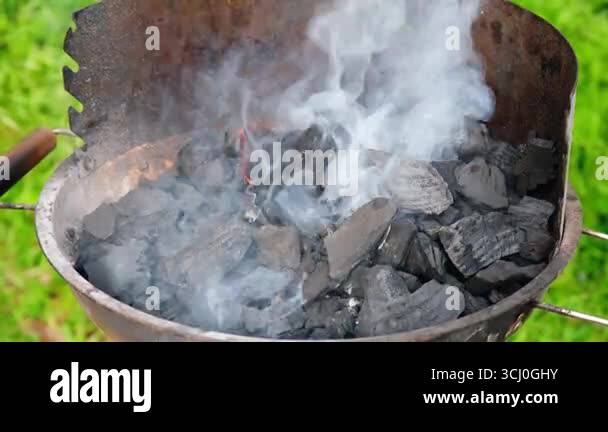 Charcoal grill with burning coals. Closeup of burning coals in a ...