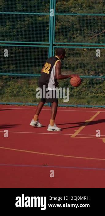 A vibrant and dynamic basketball scene featuring a skilled player ...