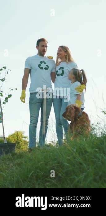 A family enjoys a day of fun outdoor activities promoting recycling and ...