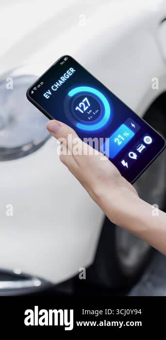 Businesswoman holding smartphone display battery status interface by ...