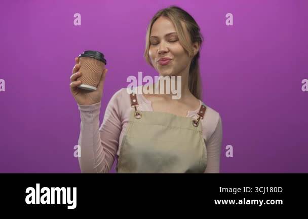 Barista woman presents coffee cup in studio environment with a casual ...