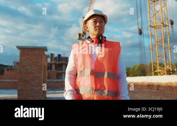 Portrait asian man builder engineer worker in hard hat with use a ...