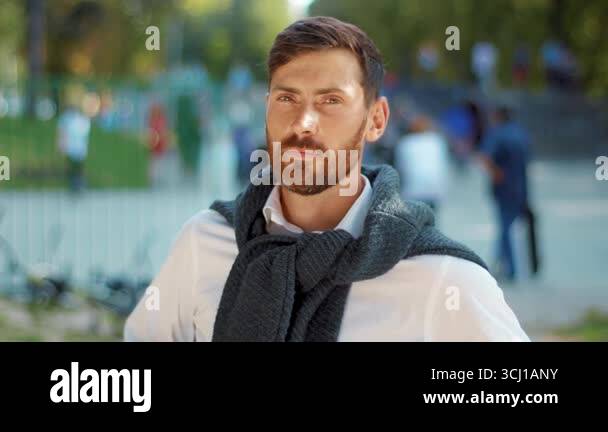 At sunlight portrait handsome disabled man in wheelchairat look at ...