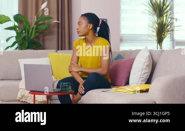 Unhappy surprised afro-american woman doing distant interview talking ...