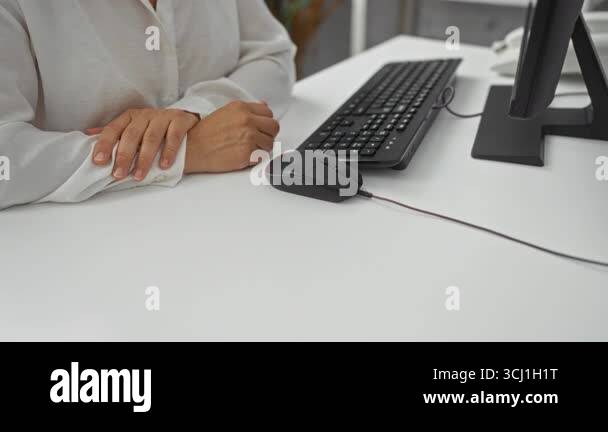 Two business people in an office exchanging a supportive gesture over a ...