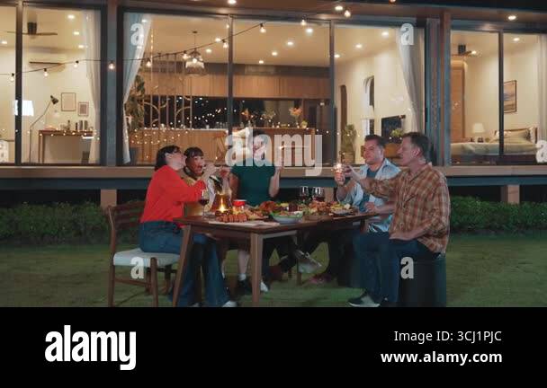 Happy family holding glowing sparkler in holiday celebration party at ...