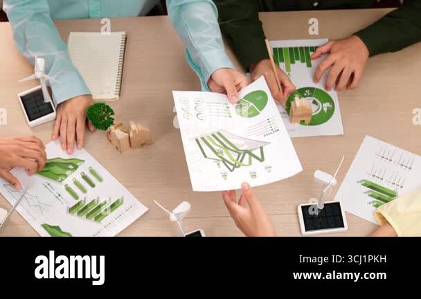 Excellent business team discussing on eco house project at meeting ...