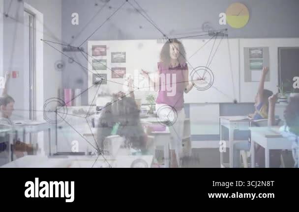 female teacher gesturing in classroom activating chart illustrating flow as students raising ...