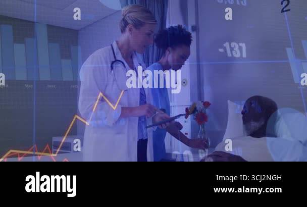 Doctor swiping tablet displaying animated vital charts while nurse ...