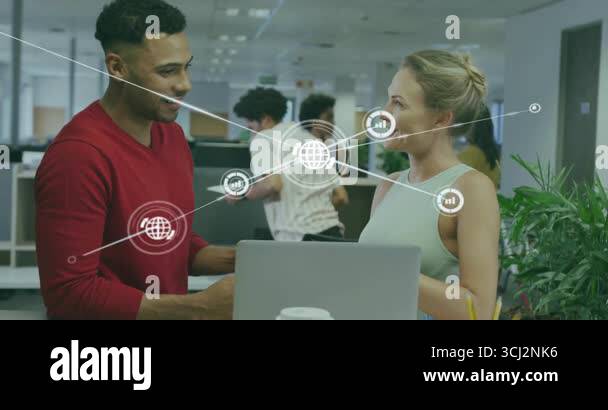 Man tapping laptop screen, woman nodding in tech office, spawning and ...