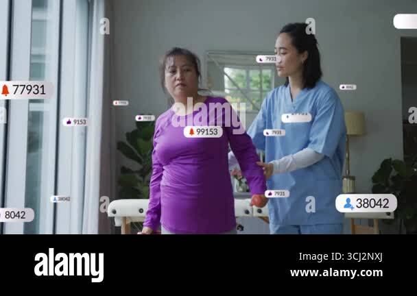 Patient lifting dumbbell as therapist placing hands under arm, floating ...