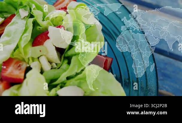 Translucent world map fading in over salad bowl, expanding across scene ...