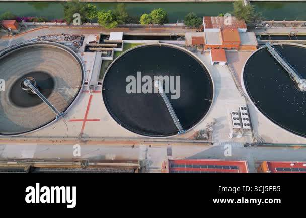 Aerial top view of sedimentation tanks in wastewater treatment facility ...