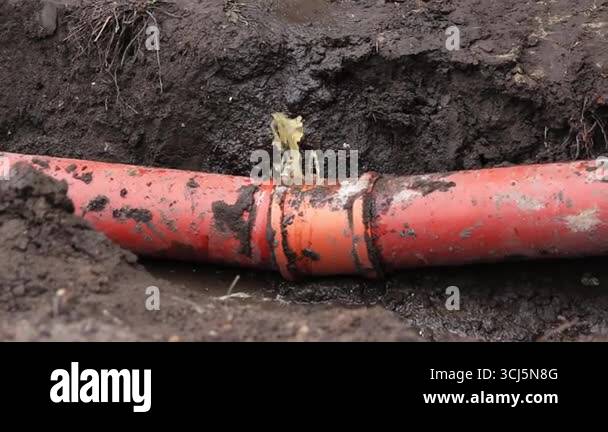 Dramatic Burst Sewer Pipe. Water and Sewage Gushing and Pouring on the ...