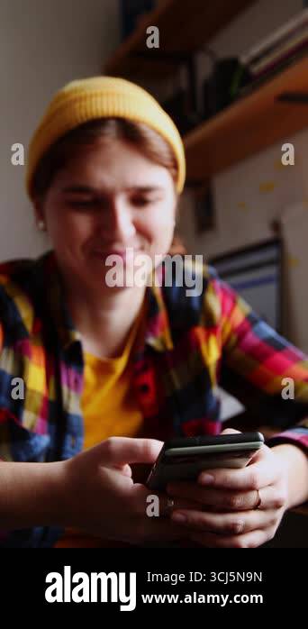 Young Gen Z Woman Scrolling on a Phone. Hipster Lifestyle. Yellow ...