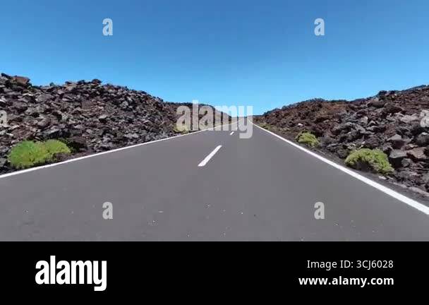 An incredibly beautiful winding road meanders through unique volcanic ...