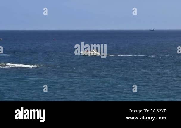 A stunning and elegant speedboat gliding gracefully over the beautiful ...